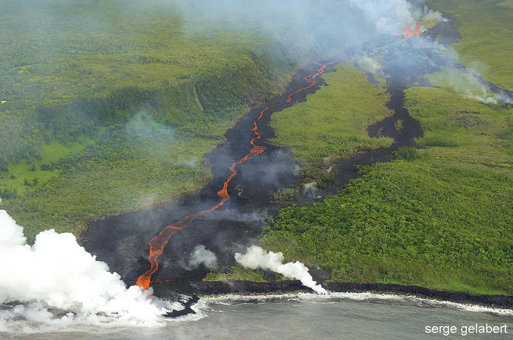 Close-up footage of lava falling into the ocean : r/gifs